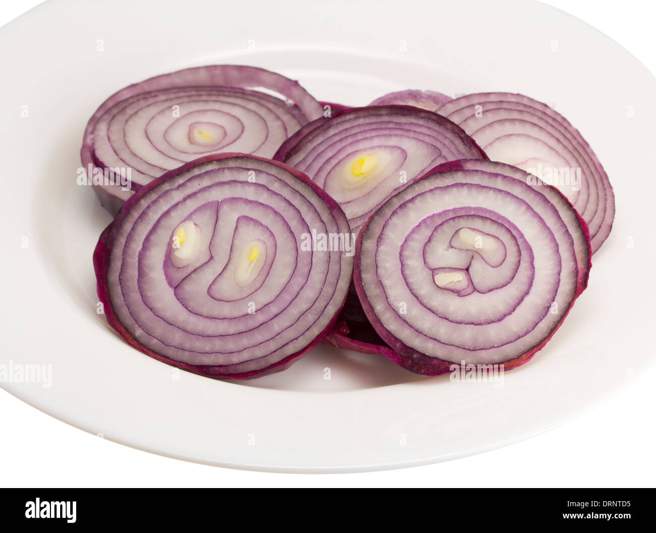 Dark blue onions on a plate on the isolated white background Stock ...