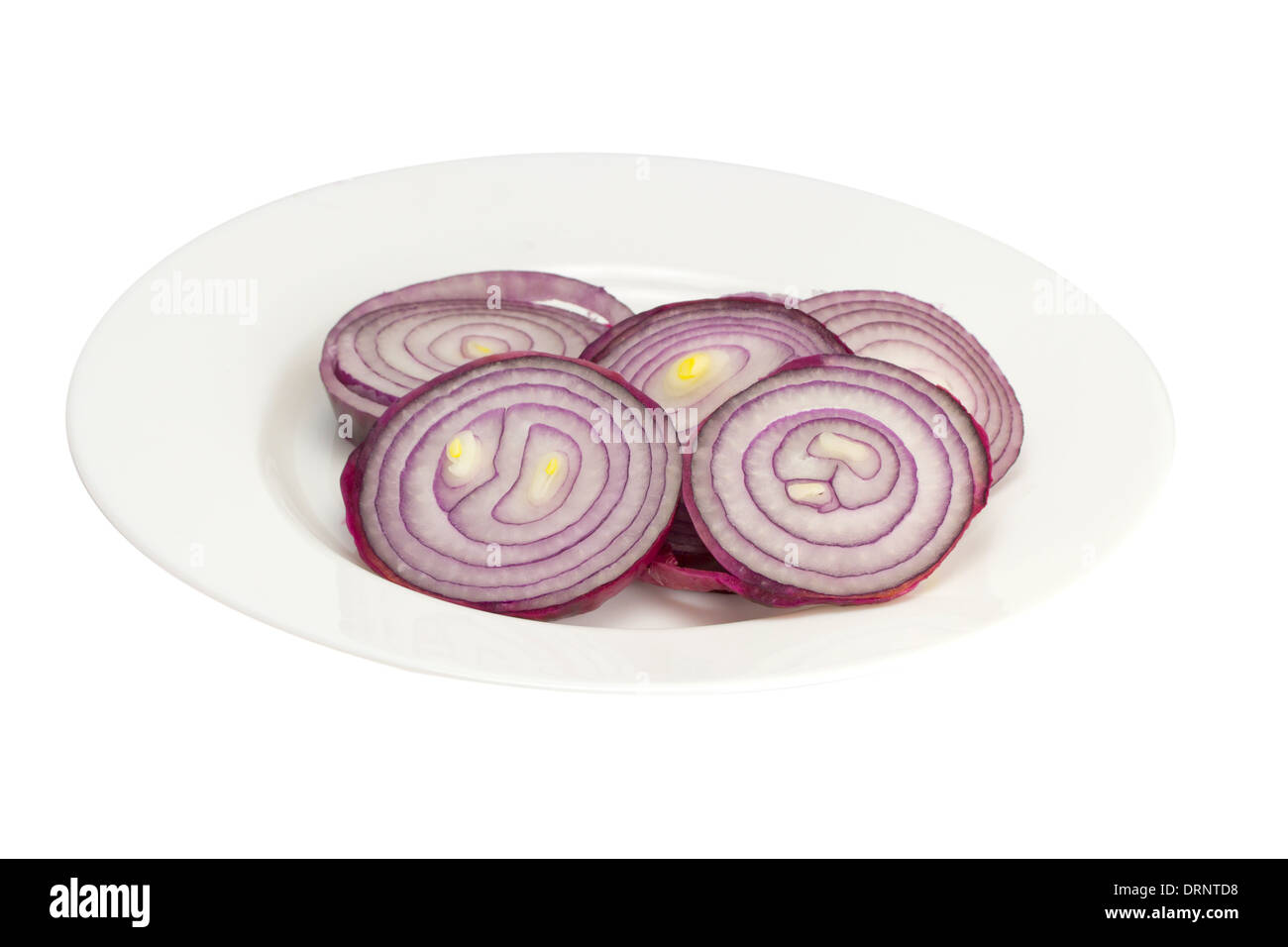 Dark blue onions on a plate on the isolated white background Stock ...