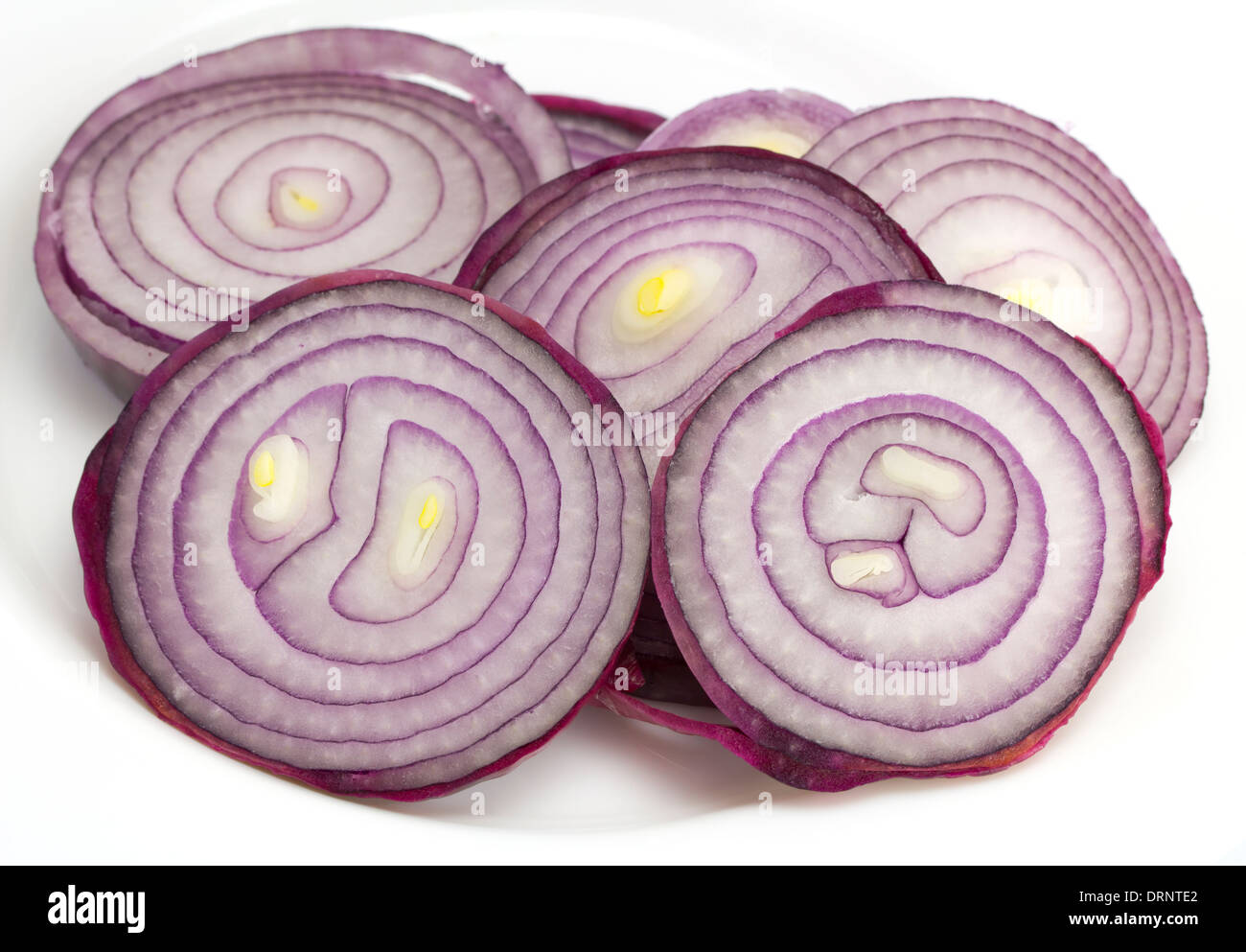 Dark blue onions on a plate on the isolated white background Stock ...