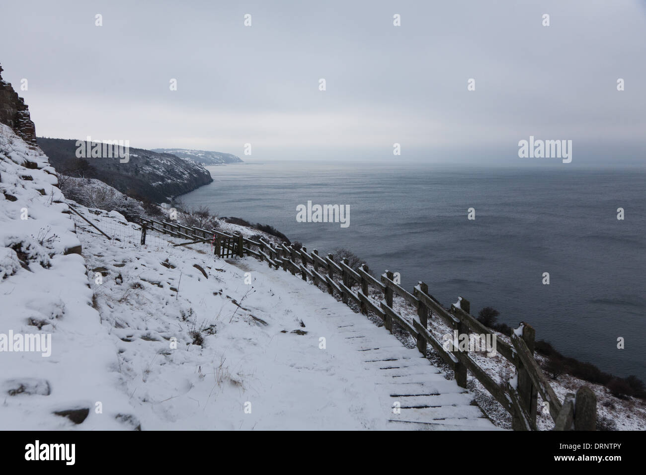 The snowy coast line on the North West coast of Bornholm with a path ...