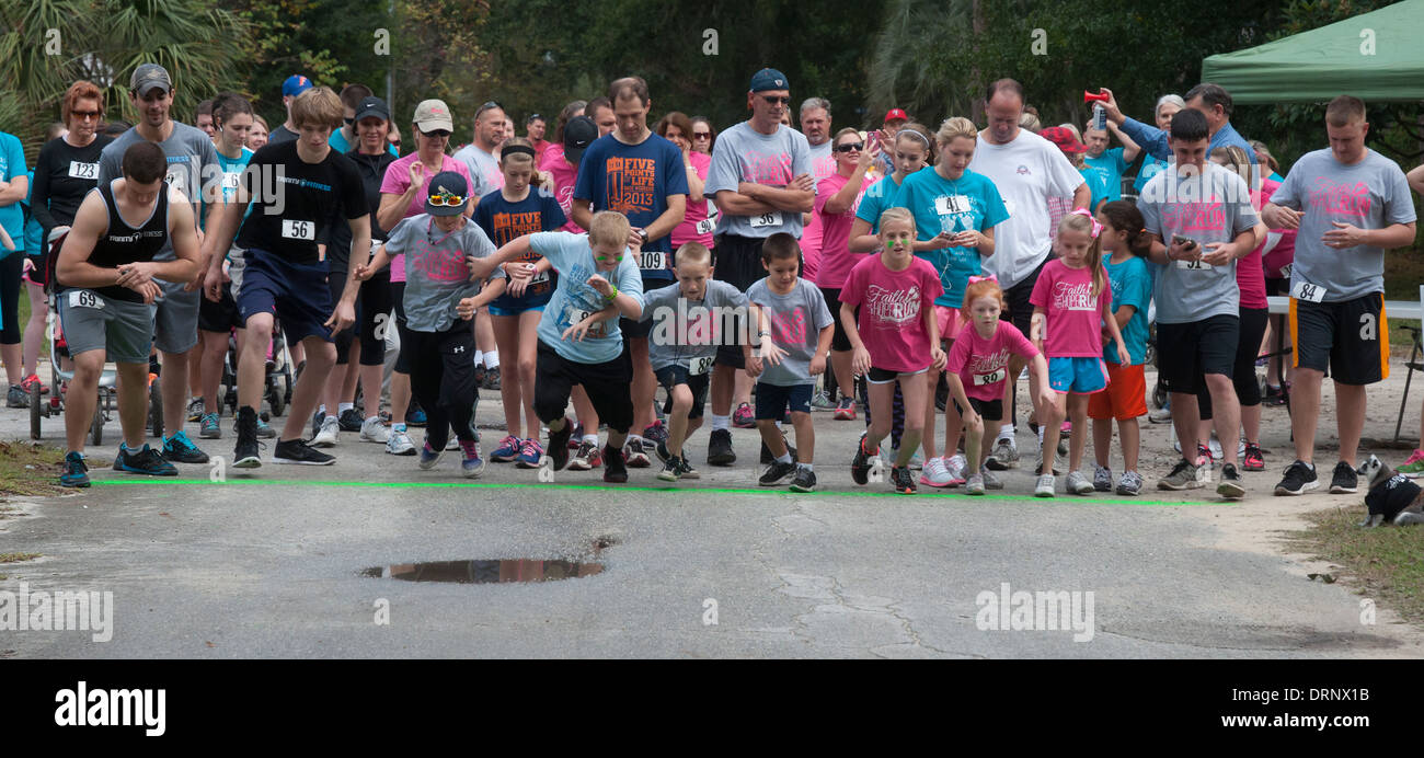 Group of runners at the start of a 5K charity run for a pro life ...