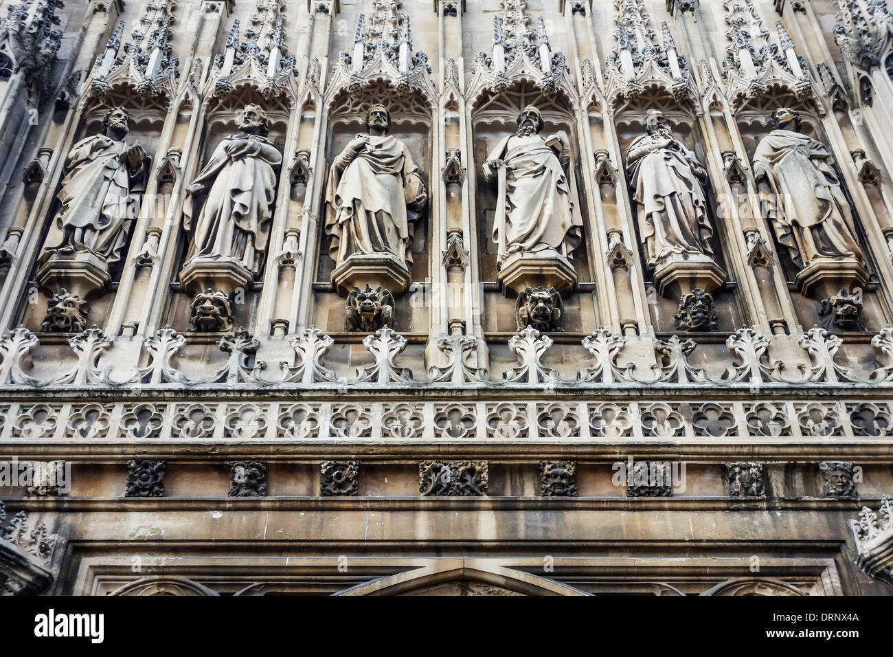Uk stonework carvings above the entrance of gloucester cathedral hi-res ...