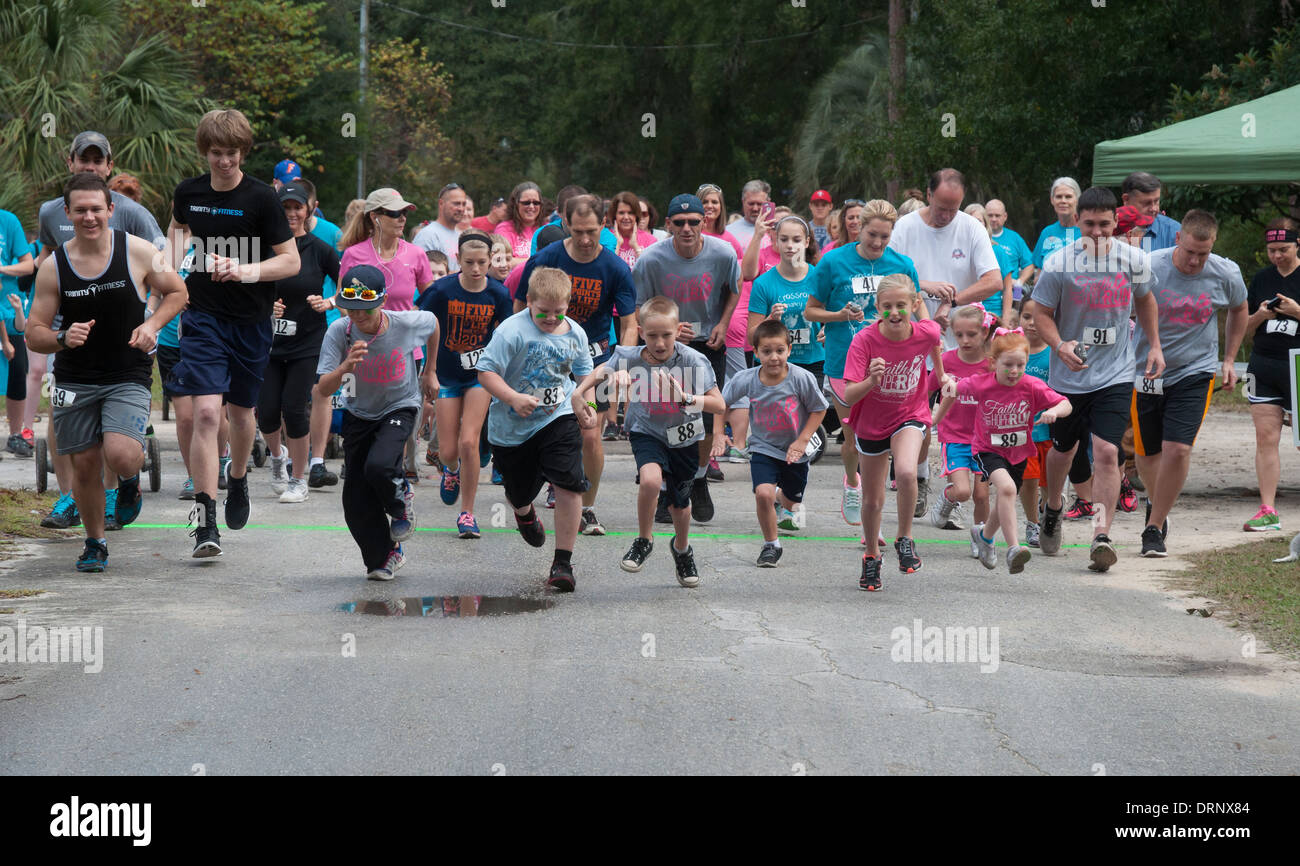 Group of runners at the start of a 5K charity run for a pro life ...