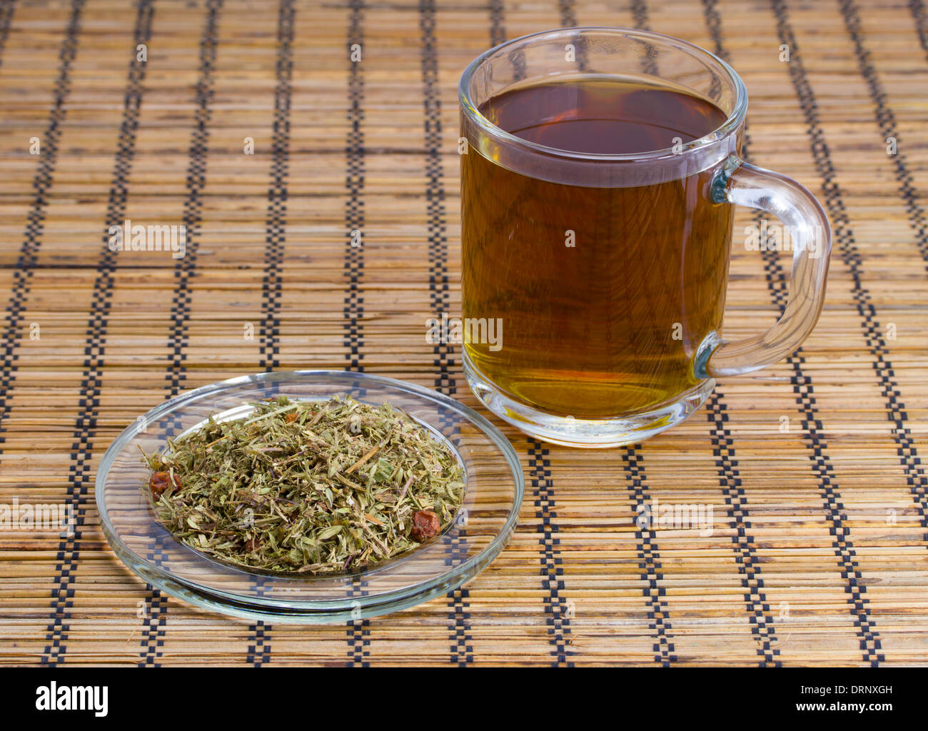 Tea on herbs on a wooden background Stock Photo - Alamy