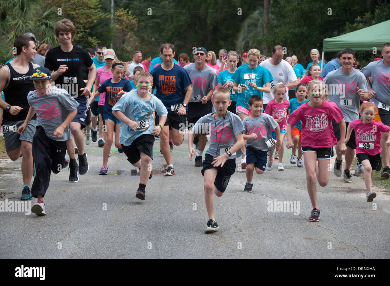 Group of runners at the start of a 5K charity run for a pro life ...