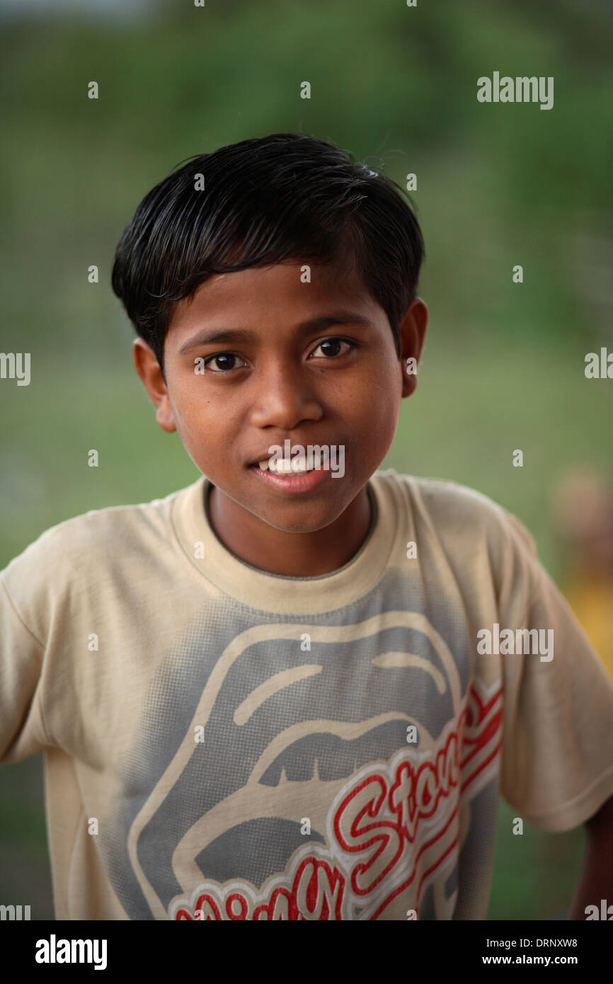 Portrait of smiling Indonesian boy looking at the camera. Sumba Island ...