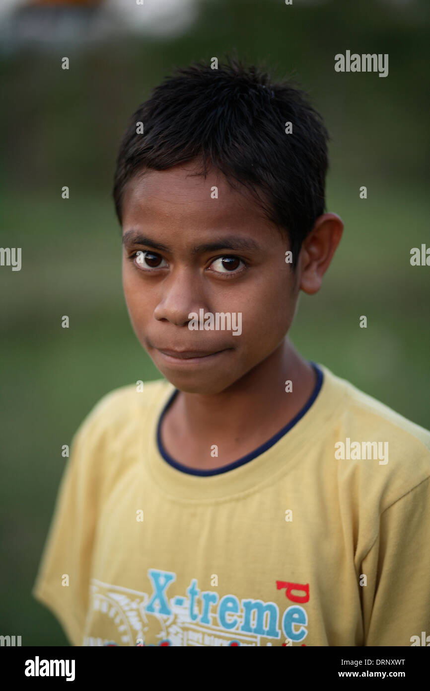 Portrait of Indonesian boy looking at the camera. Sumba Island ...