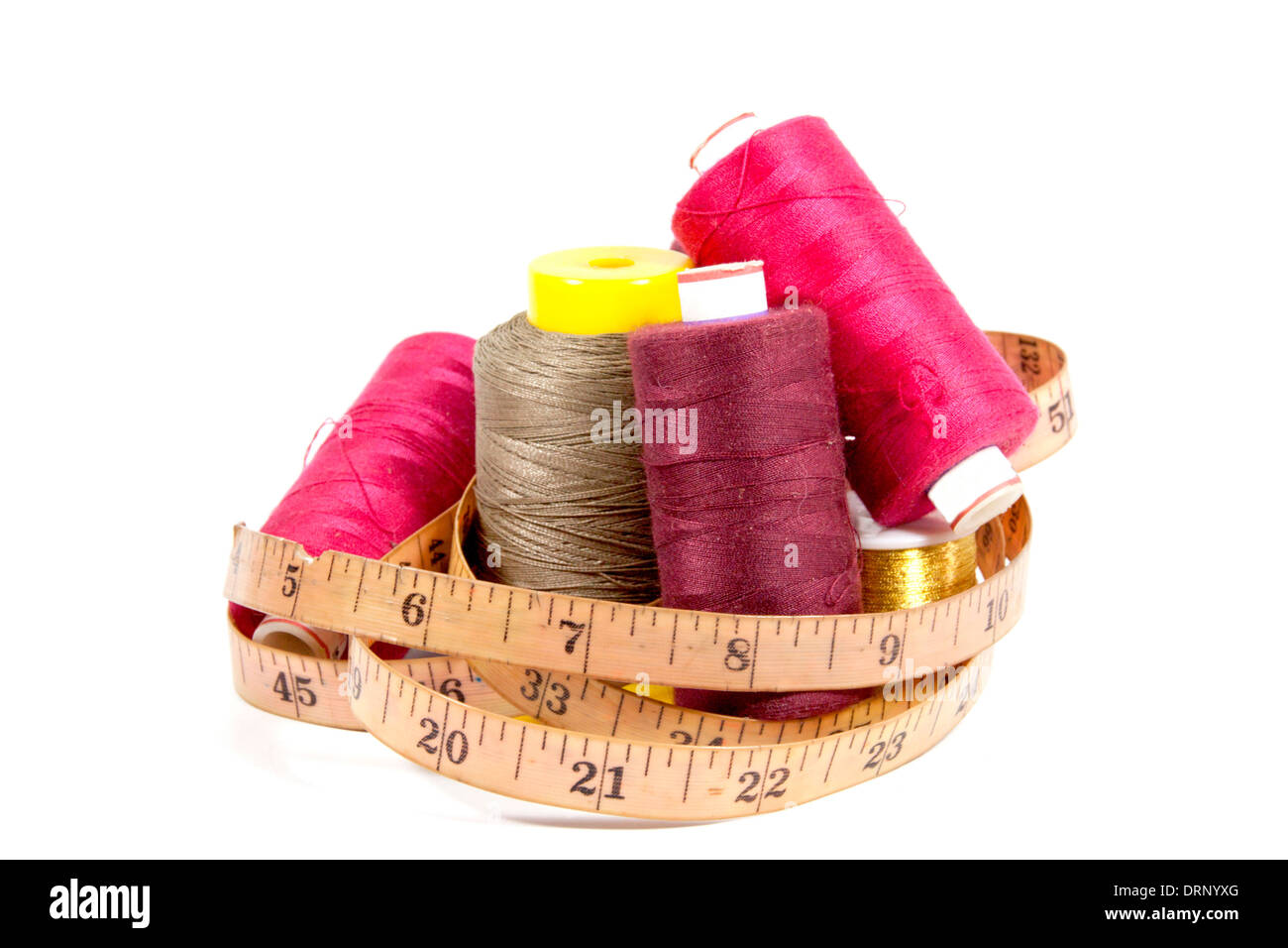 studio shot colorful collection of cotton reels and vintage tape ...