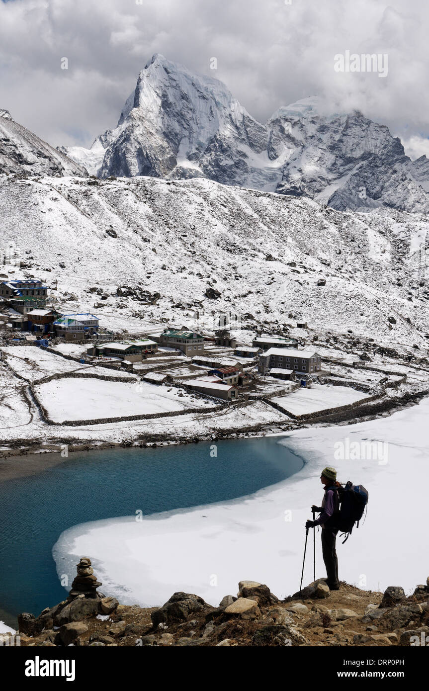 A lady trekker on the ascent to Gokyi Ri, with the Gokyo Lakes below ...