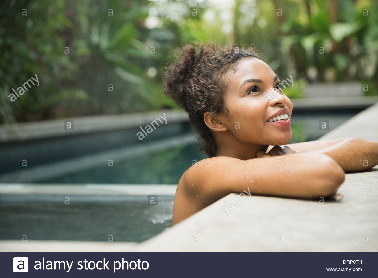 Woman at swimming pool hi-res stock photography and images - Alamy