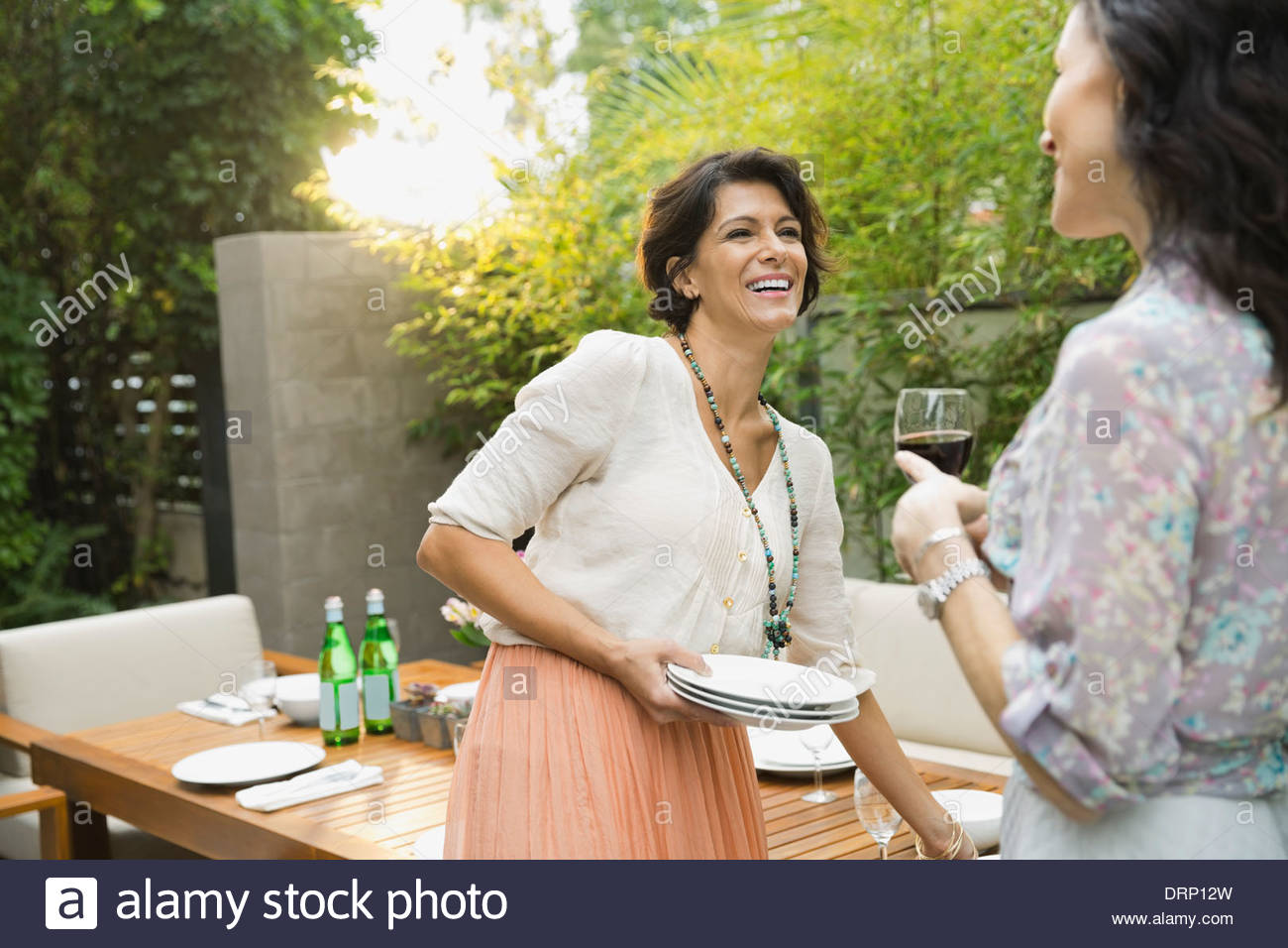 Standing at table hi-res stock photography and images - Alamy