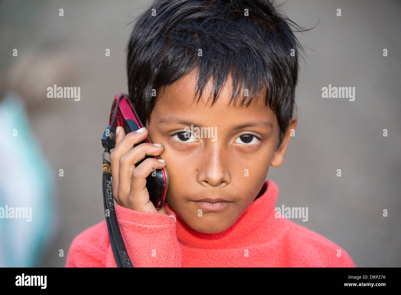 Indian boy child mobile phone hi-res stock photography and images - Alamy