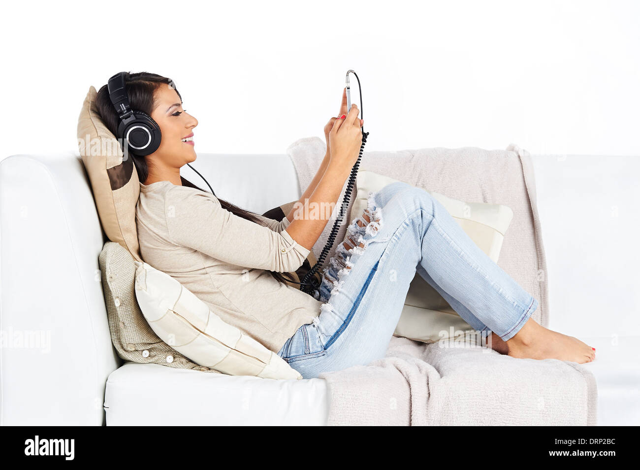 Young beautiful relaxed casual woman listening to music Stock Photo - Alamy