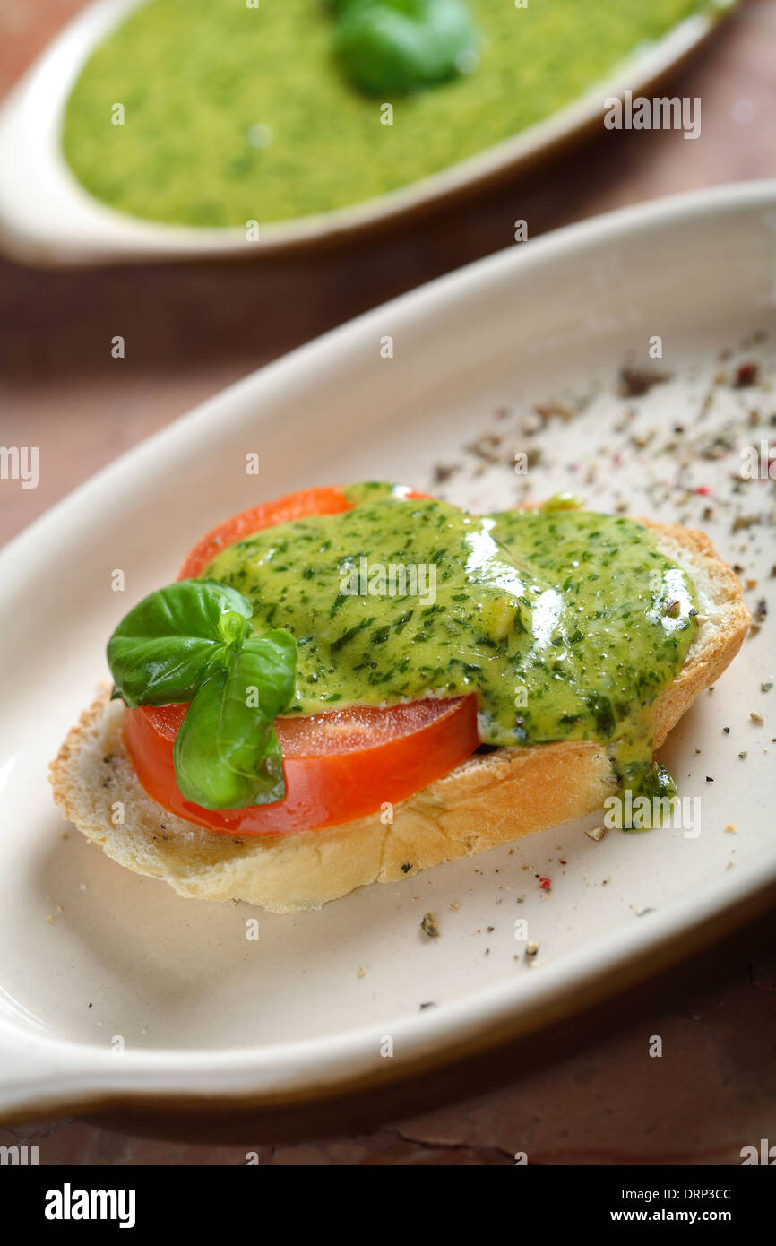 Bread with basil dressing - aioli Stock Photo - Alamy