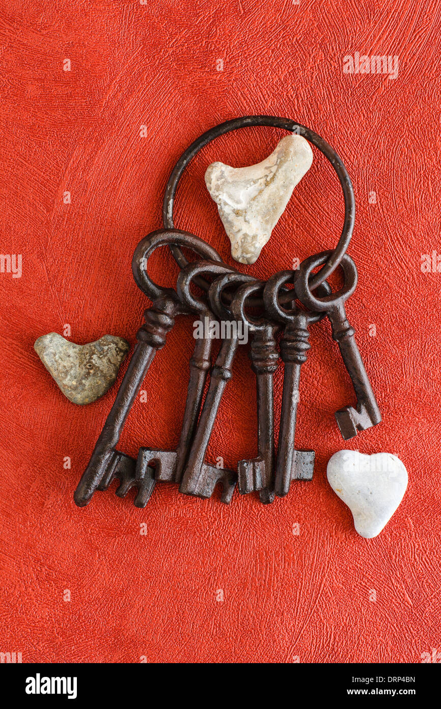 Old key and heart of stone Stock Photo - Alamy