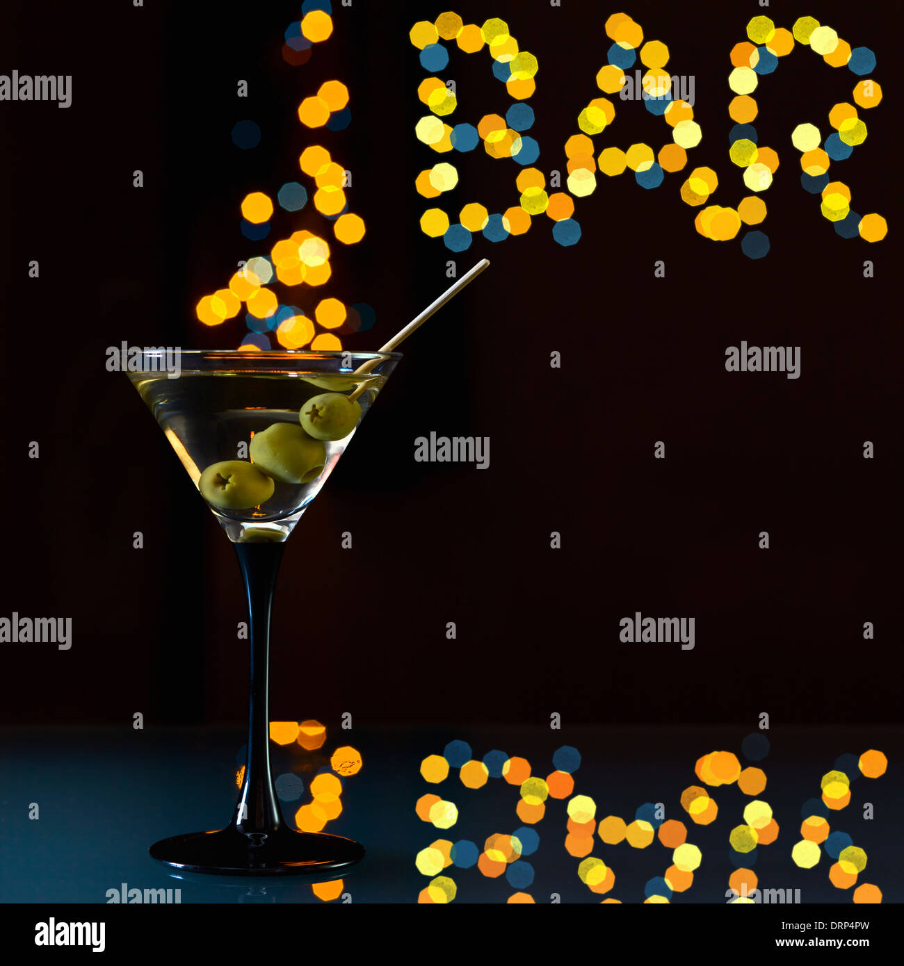 martini and green olives on glass table in bar Stock Photo - Alamy