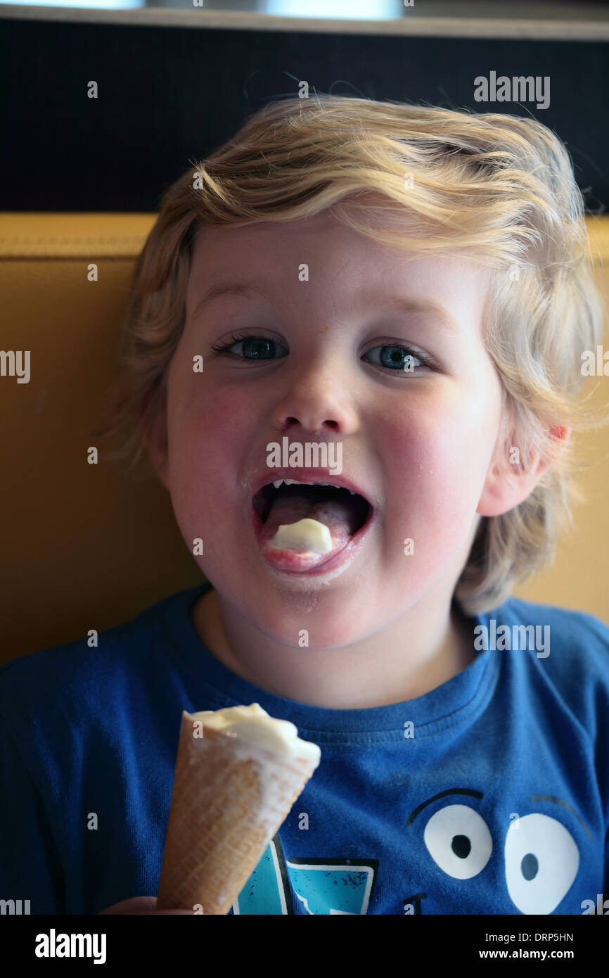 Boy eating ice cream cold treat smile hi-res stock photography and ...