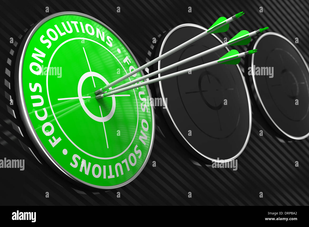 Focus on Solutions Slogan - Green Target Stock Photo - Alamy