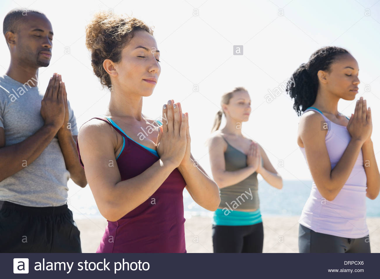 Group exercise on beach hi-res stock photography and images - Alamy