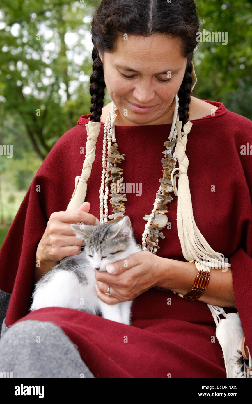 Native American Indian Lakota Sioux woman petting a kitten Stock Photo ...