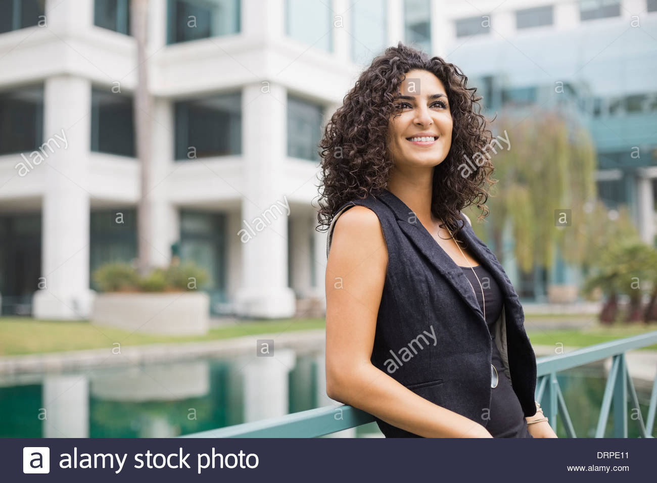 Woman leaning on railing looking at hi-res stock photography and images ...