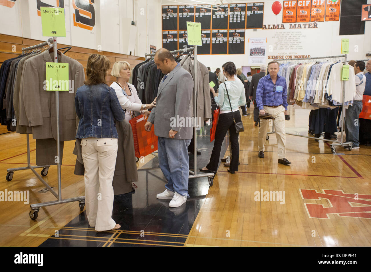 Men get new business clothing from Working Wardrobes, a organization helping the unemployed ...
