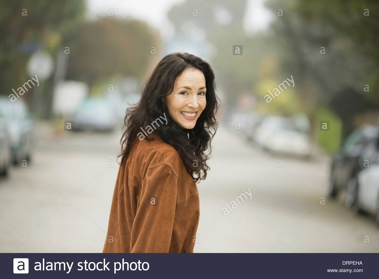 Woman standing outdoors hi-res stock photography and images - Alamy