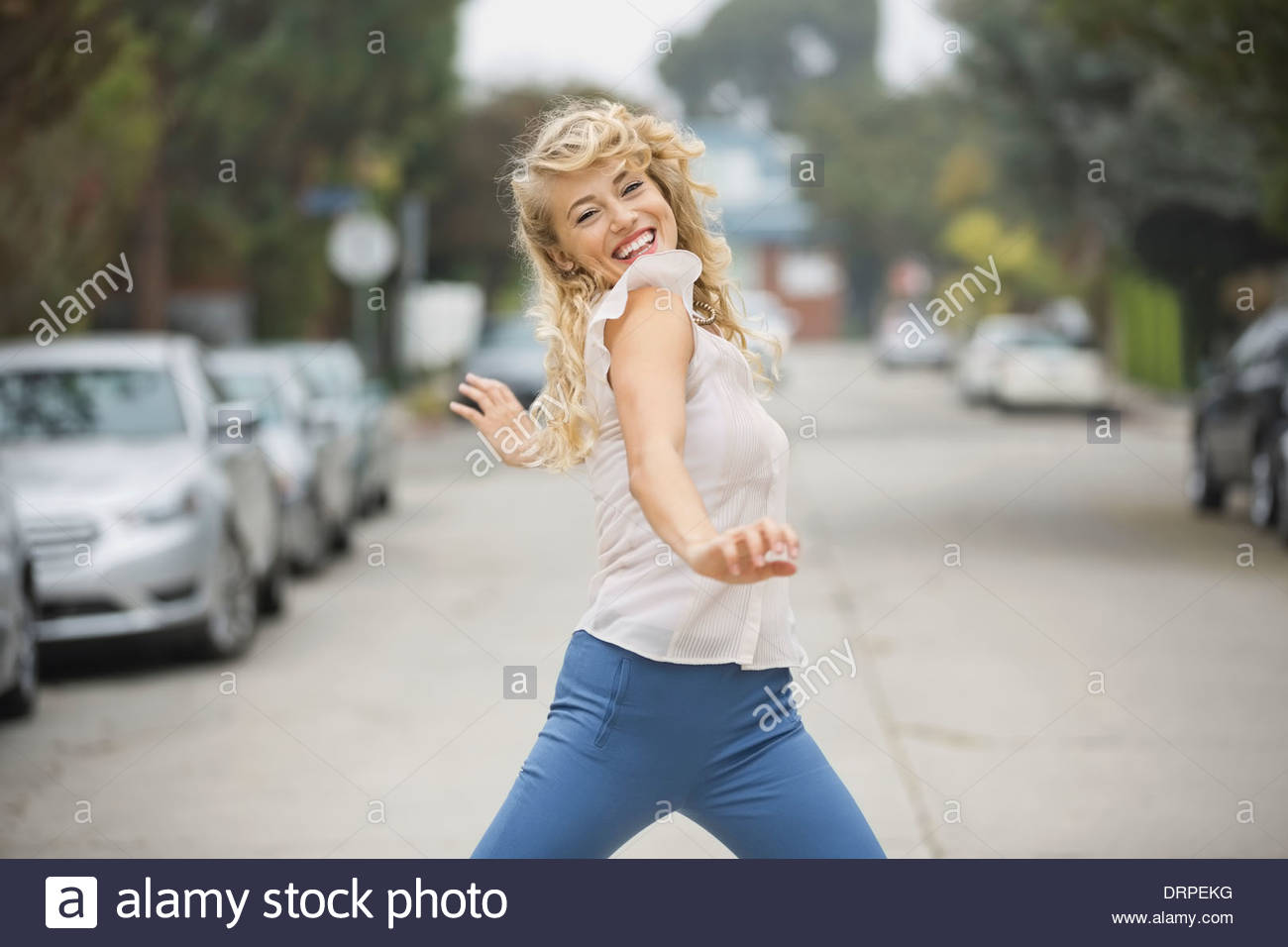 Woman dancing on the street hi-res stock photography and images - Alamy