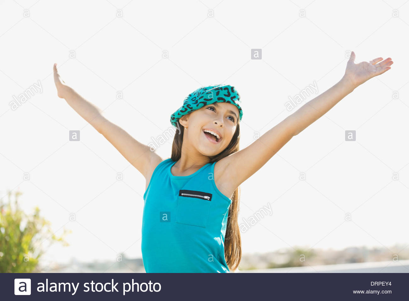 Girl standing with arms open hi-res stock photography and images - Alamy