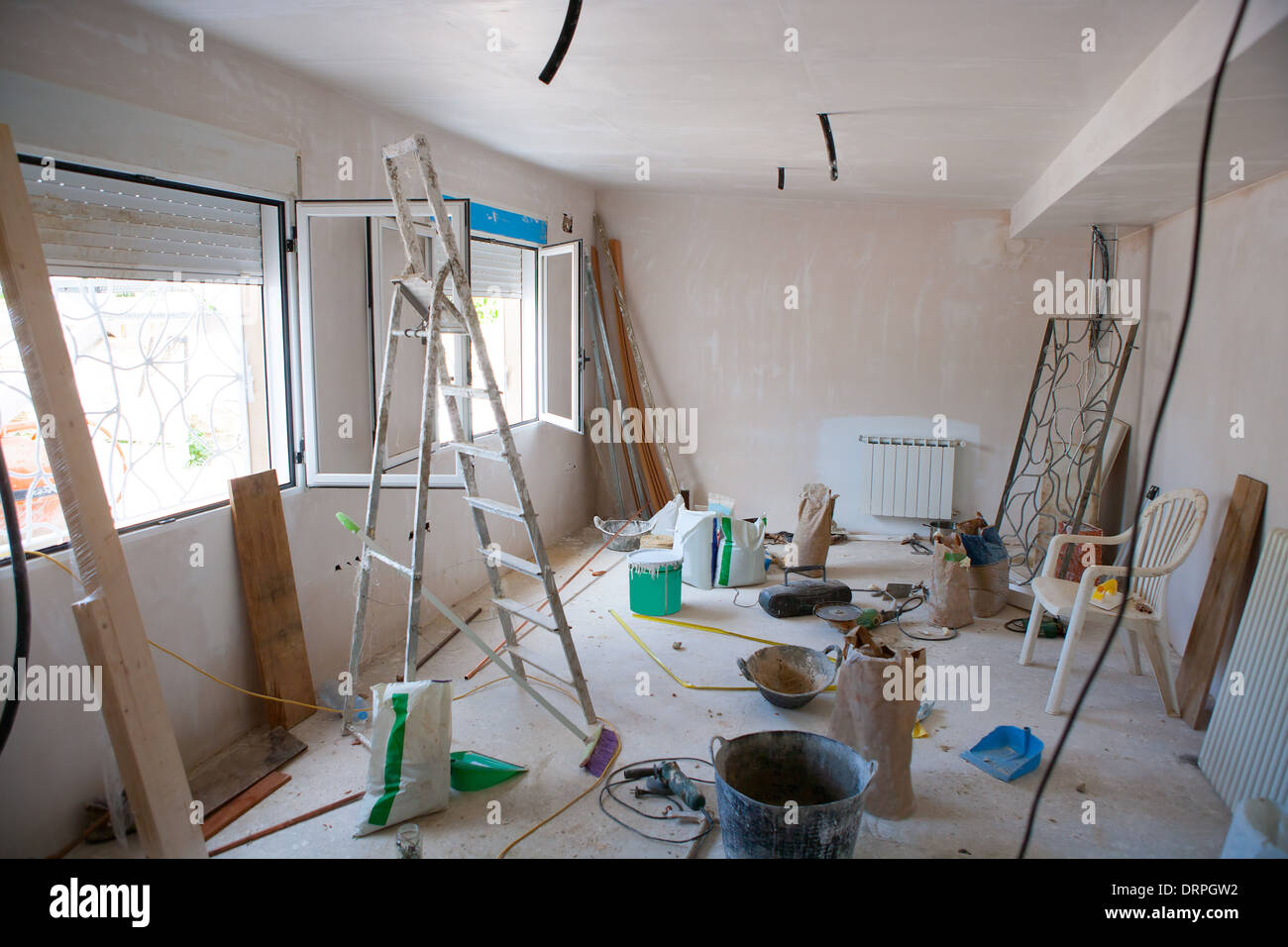 House indoor improvements in a messy room construction with plaste ...