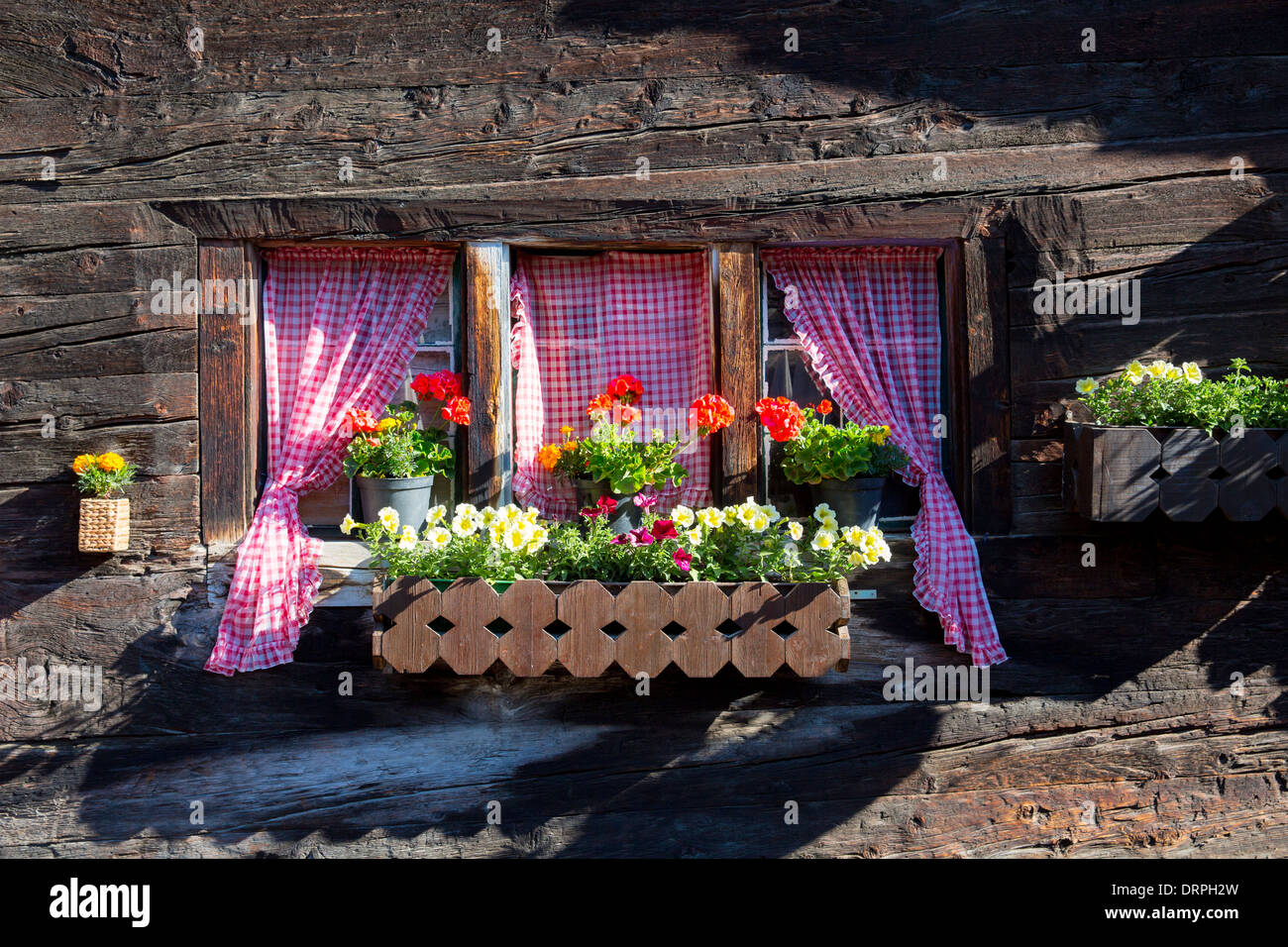 Traditional window of chalet in village of Zmutt in the Swiss Alps near ...