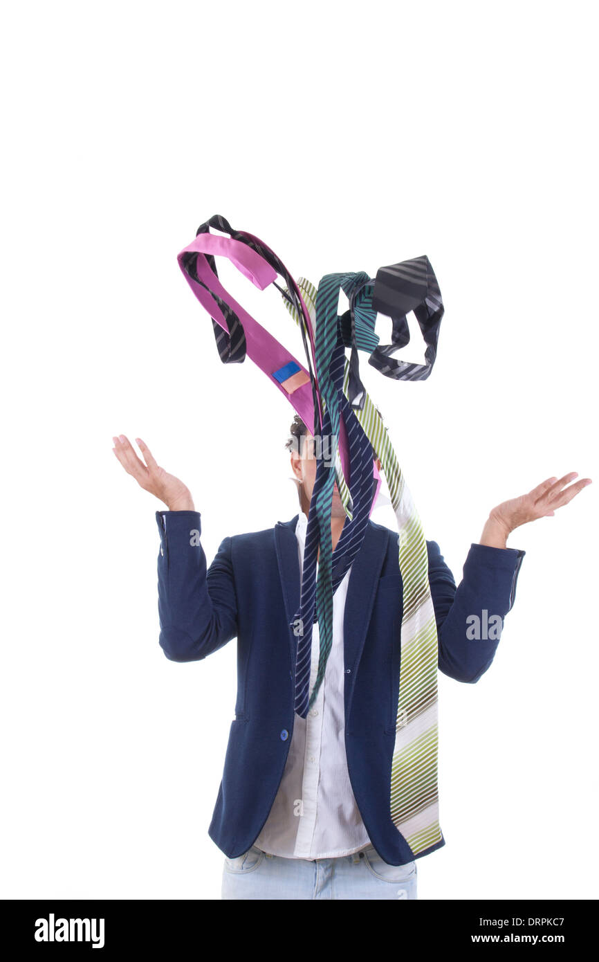 undecided man in suit with lot of ties all around him Stock Photo - Alamy