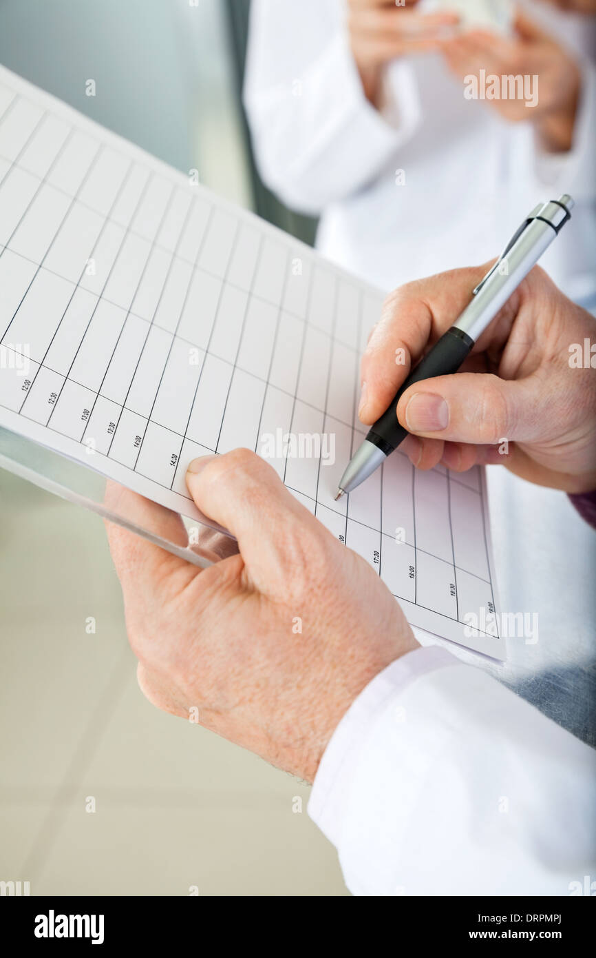 Researcher writing on clipboard hi-res stock photography and images - Alamy