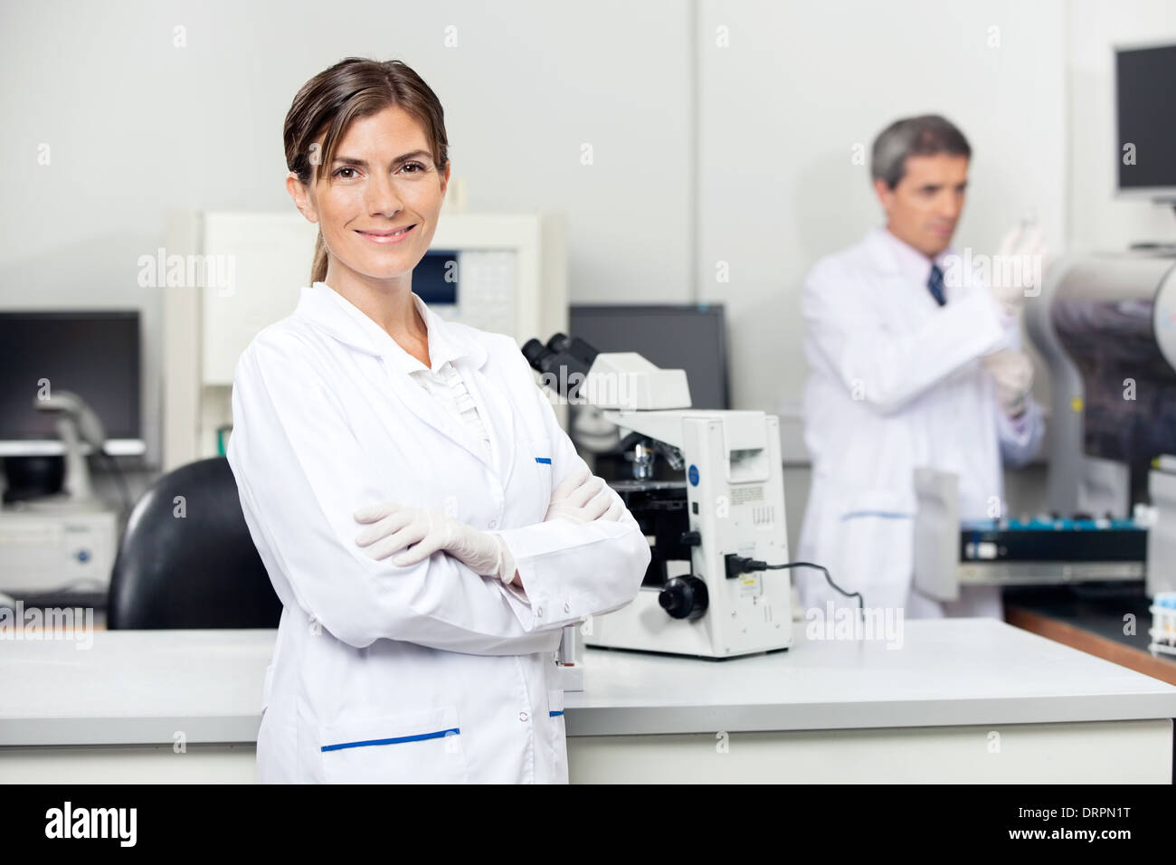 Confident female researcher in hi-res stock photography and images - Alamy