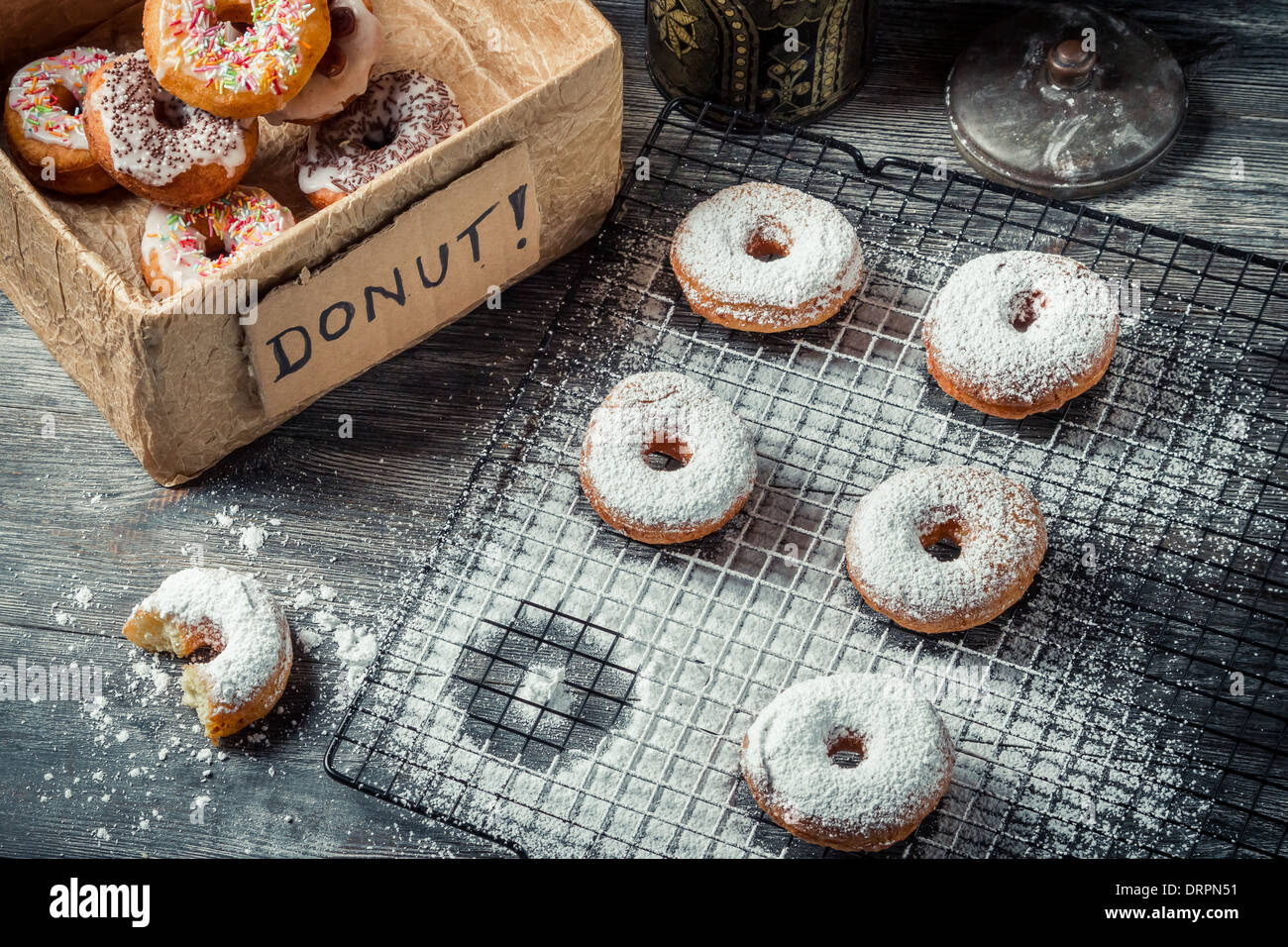Tasting freshly baked donuts Stock Photo - Alamy