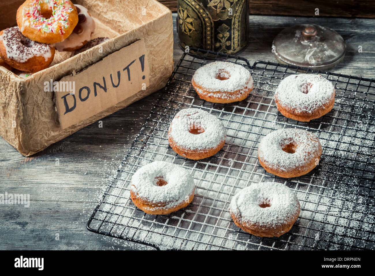 Tasting freshly baked donuts Stock Photo - Alamy