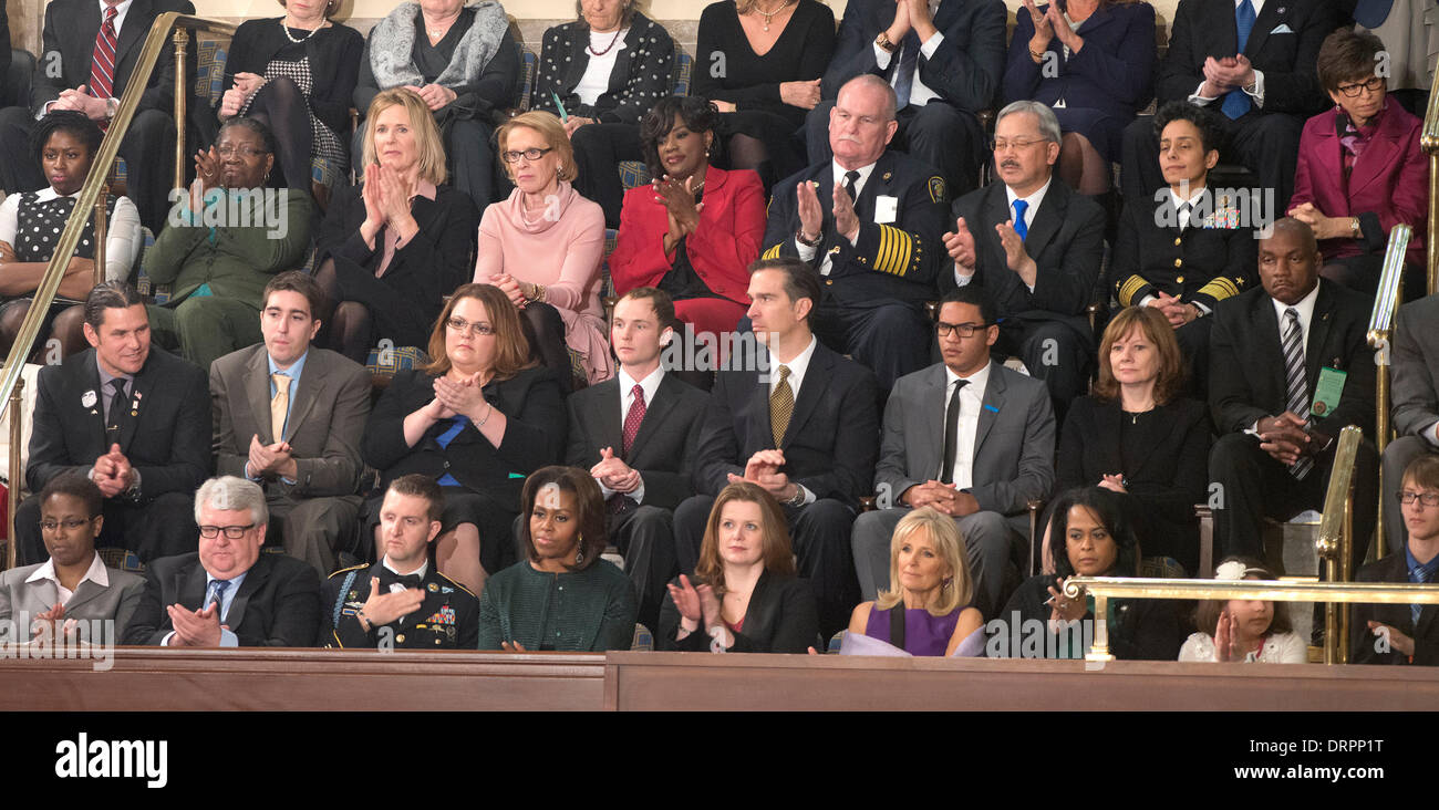 Attendees in the First Lady's box applaud as United States President ...
