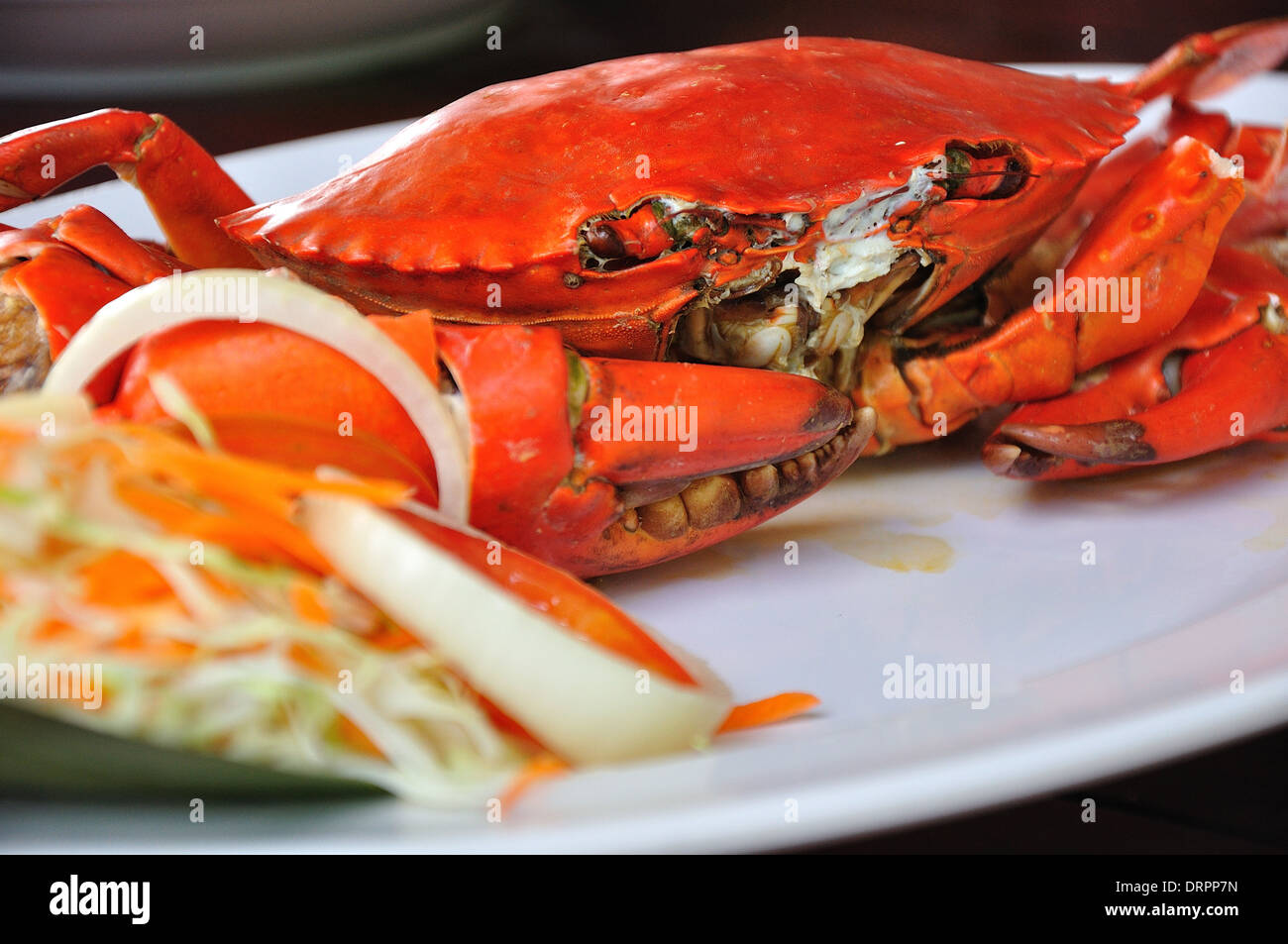 Undressed roasted crabs prepared on plate Stock Photo - Alamy