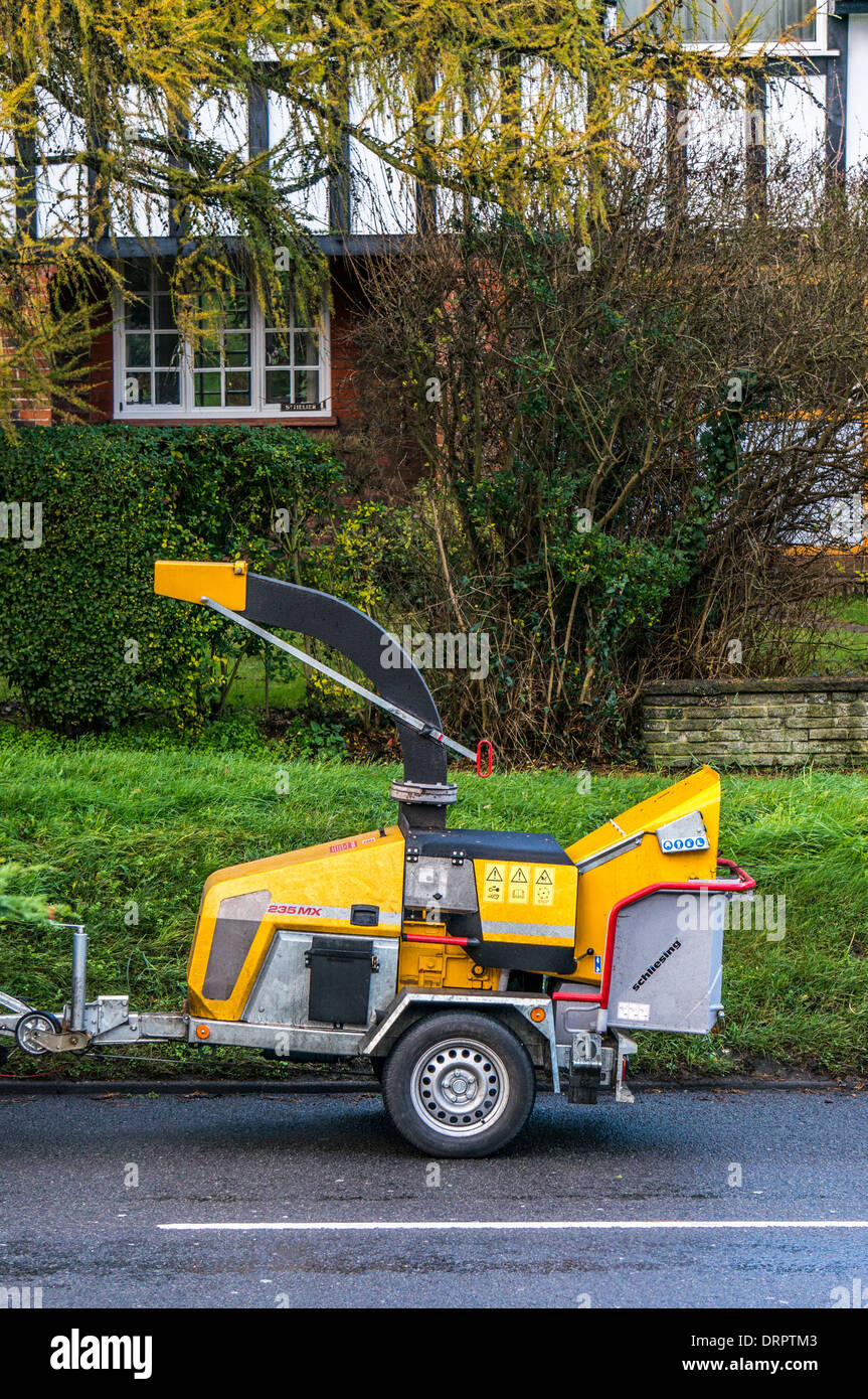 Heavy duty wood chipping machine (wood chipper) parked in the road, in ...