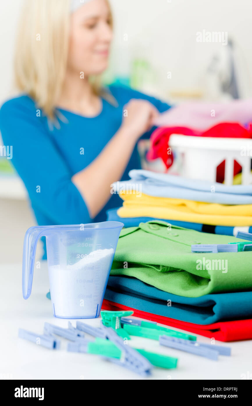 Laundry clothespin - woman folding clothes Stock Photo - Alamy