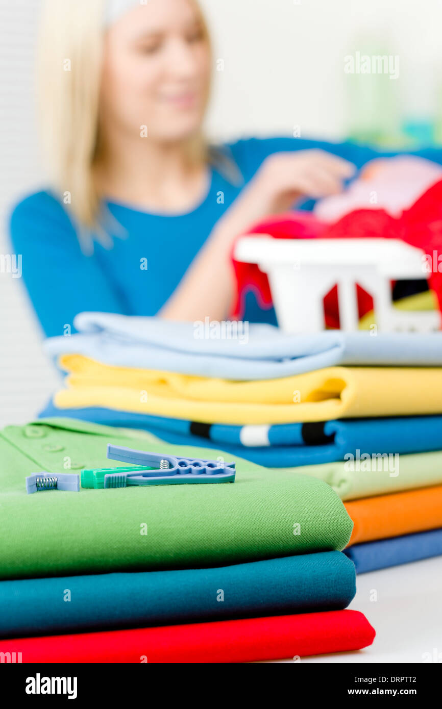 Laundry clothespin - woman folding clothes Stock Photo - Alamy