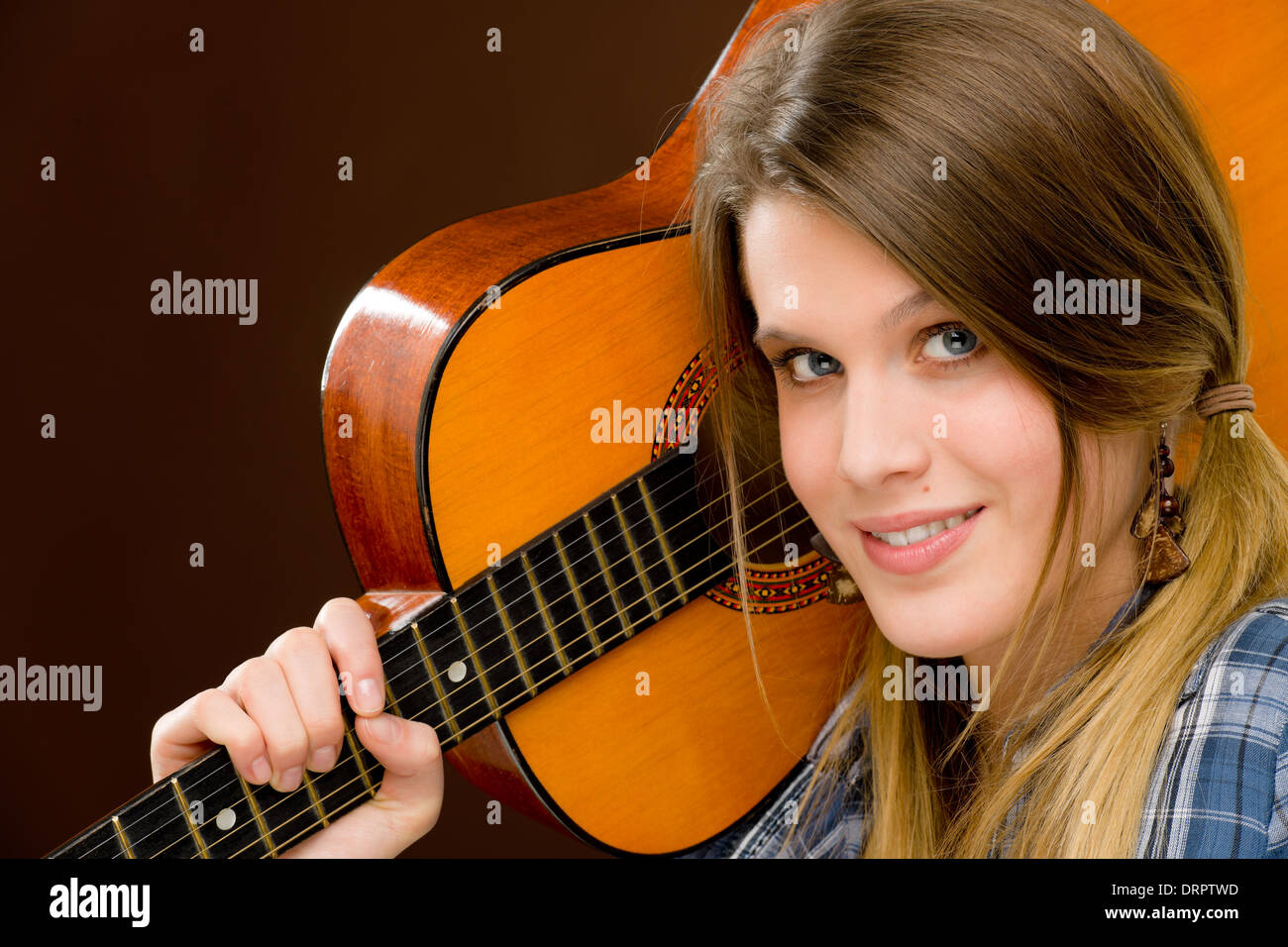 Rock musician - fashion woman holding guitar Stock Photo - Alamy