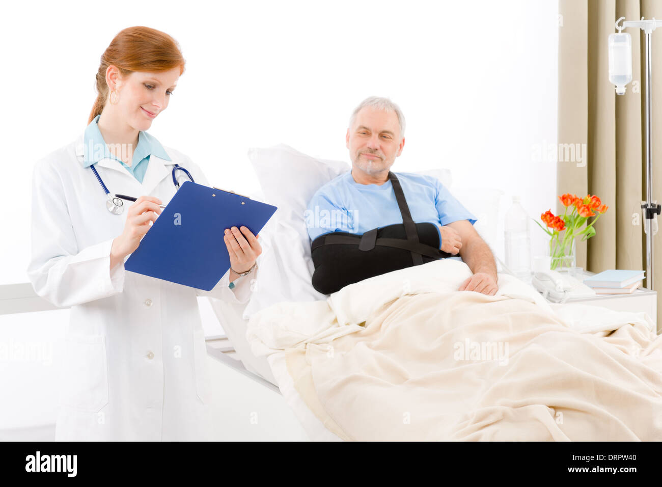 Hospital - doctor examine patient broken arm Stock Photo - Alamy