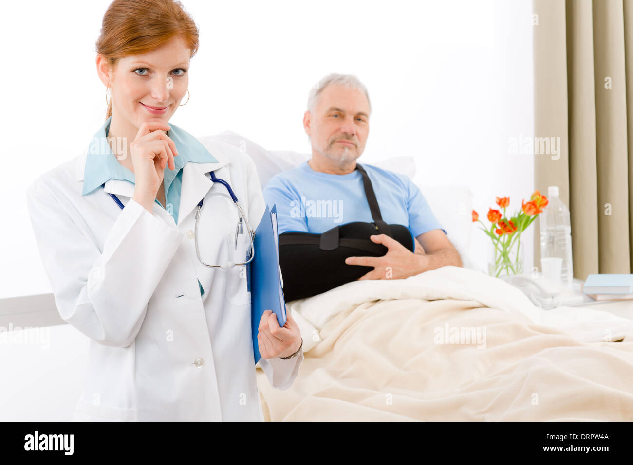Hospital - doctor examine patient broken arm Stock Photo - Alamy