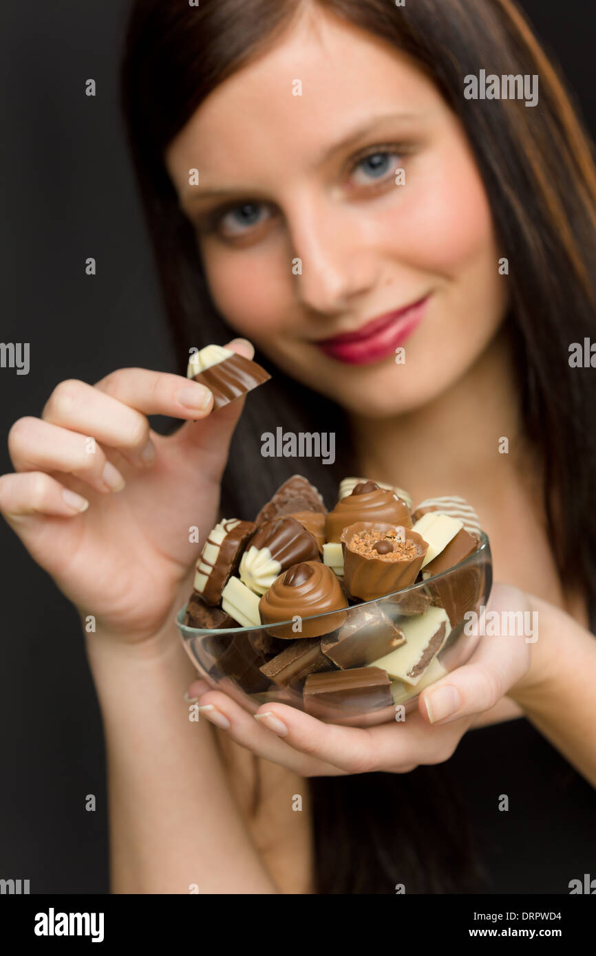 Chocolate - portrait young woman enjoy candy Stock Photo - Alamy