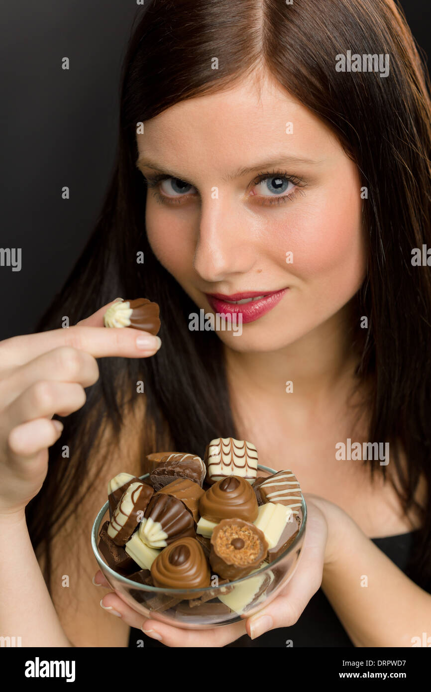 Chocolate - portrait young woman enjoy candy Stock Photo - Alamy