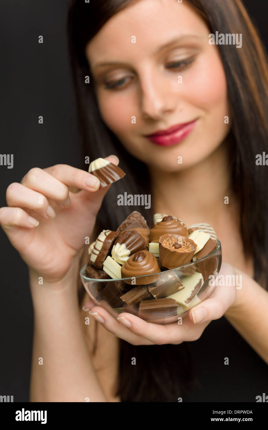 Chocolate - portrait young woman enjoy candy Stock Photo - Alamy