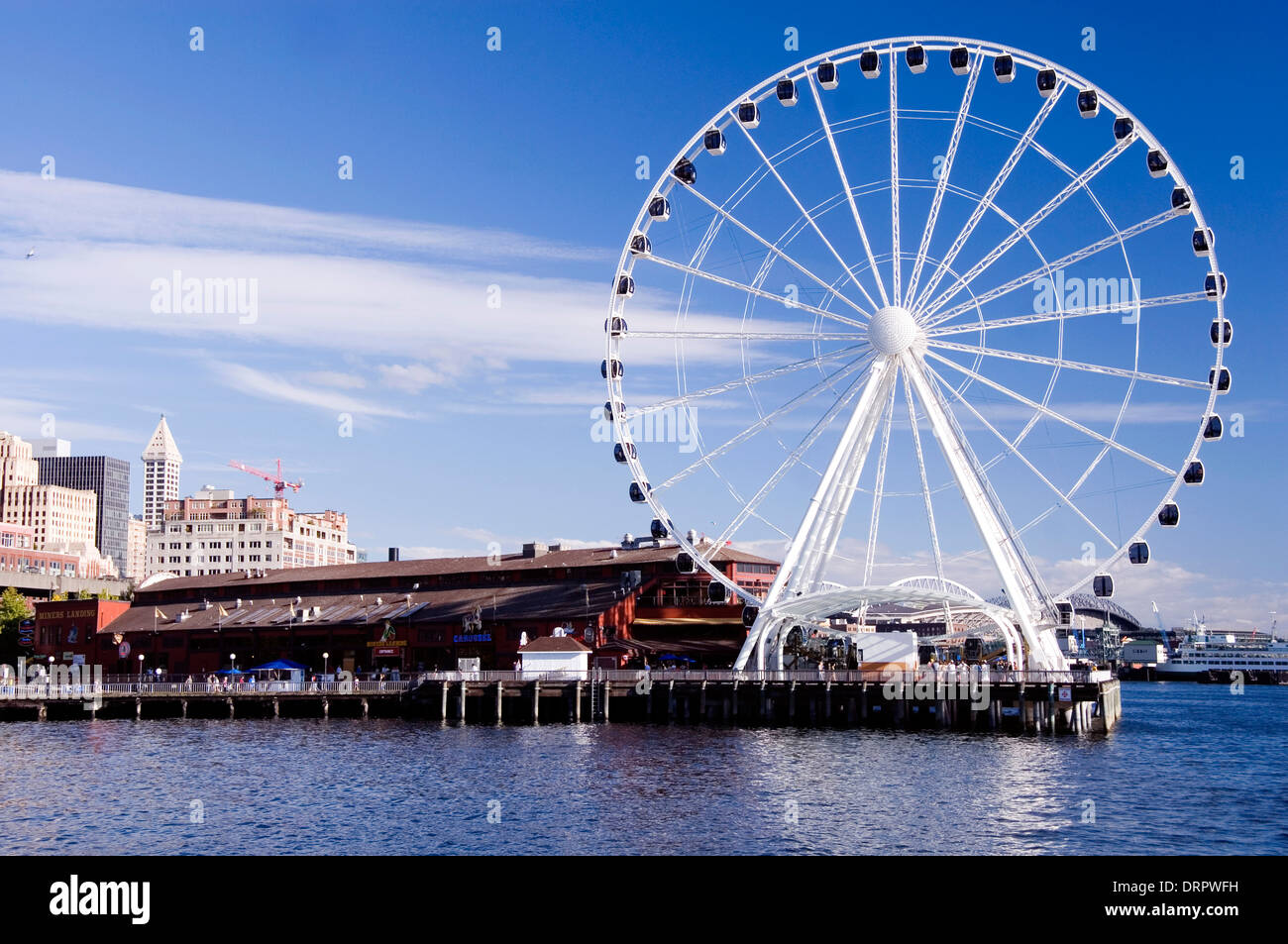 The Seattle Great Wheel ferris wheel at the end of a boardwalk at the ...