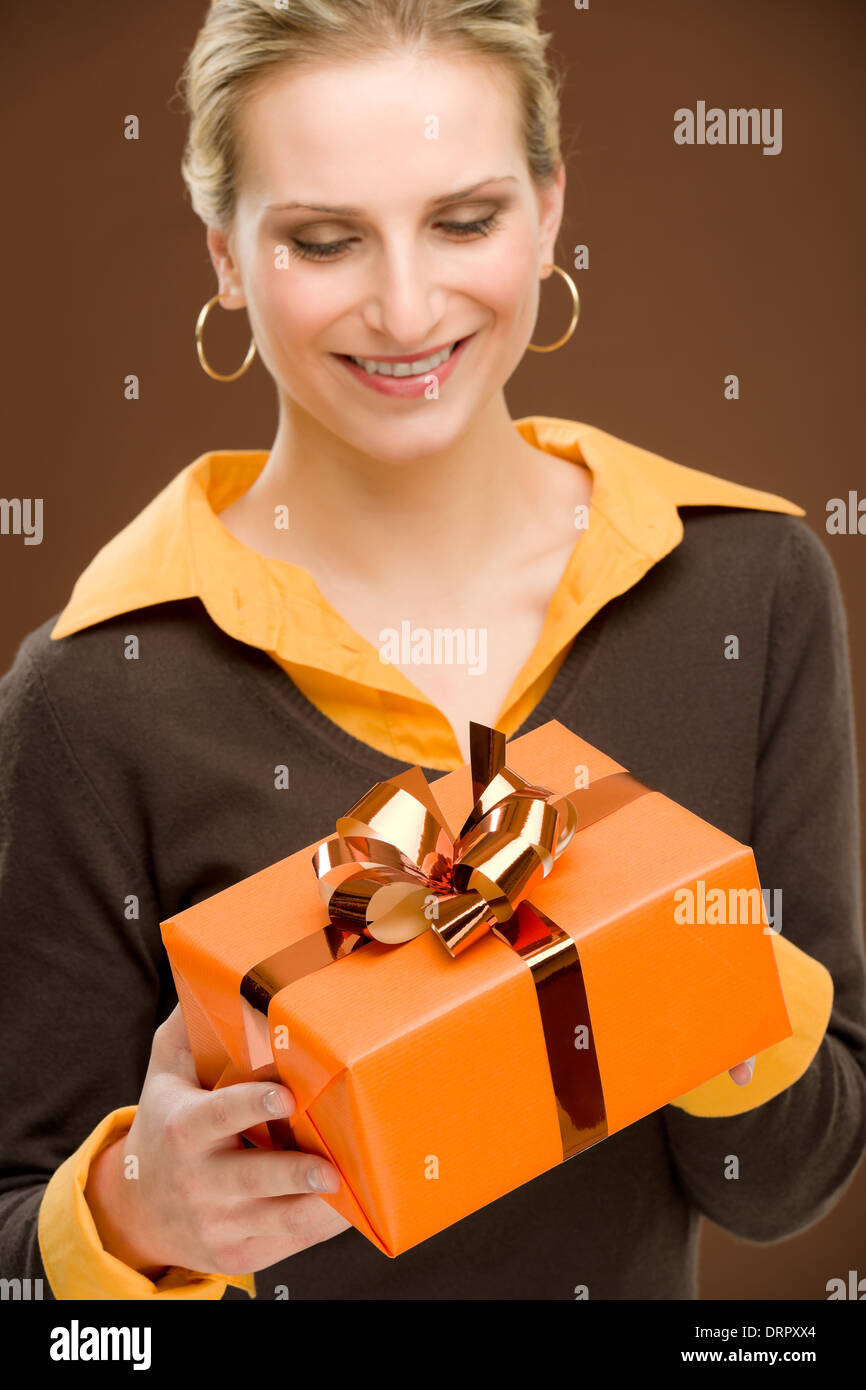 Present woman celebration hold happy Stock Photo - Alamy