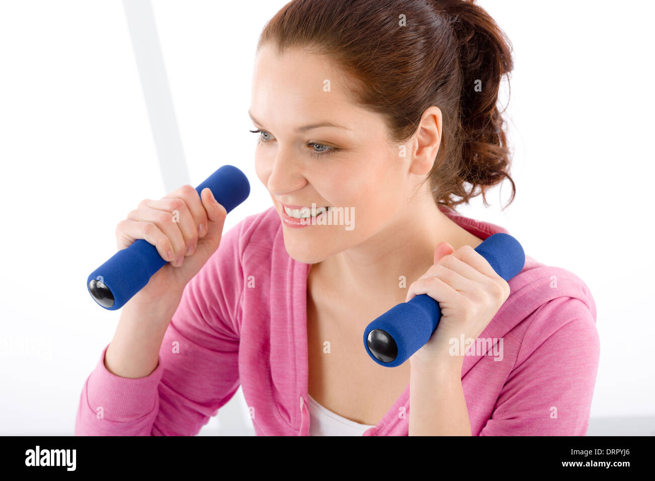 Fitness happy woman exercise dumbbell gym Stock Photo - Alamy